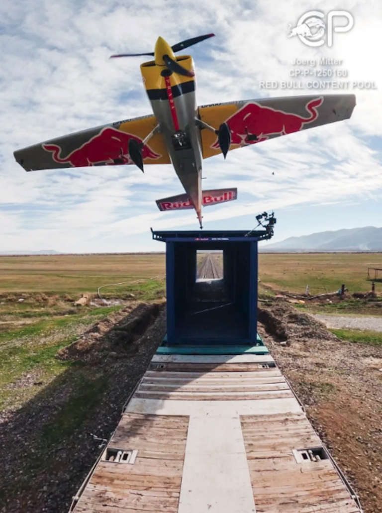 Red Bull pilot Dario Costa lands plane on moving cargo train in world ...